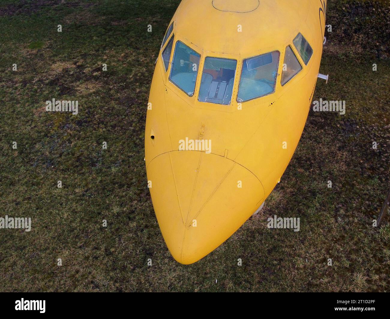aerial view from drone of a small old jet yellow passenger plane ...