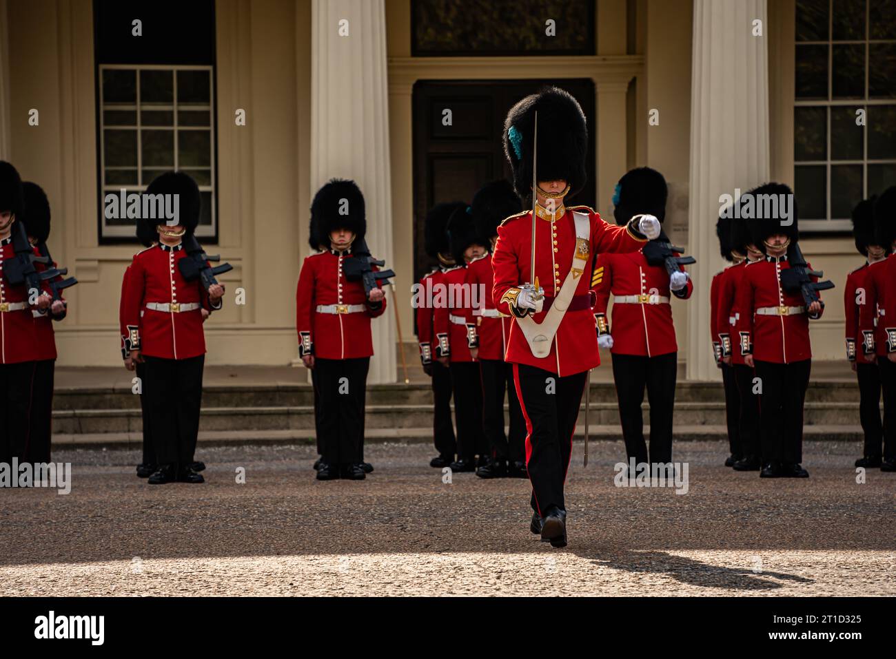 Changing the Guards at Buckingham Palace takes place in front of ...