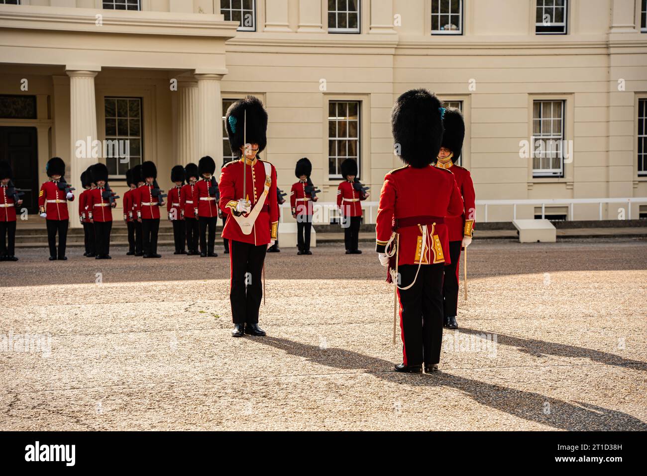 Changing the Guards at Buckingham Palace takes place in front of ...
