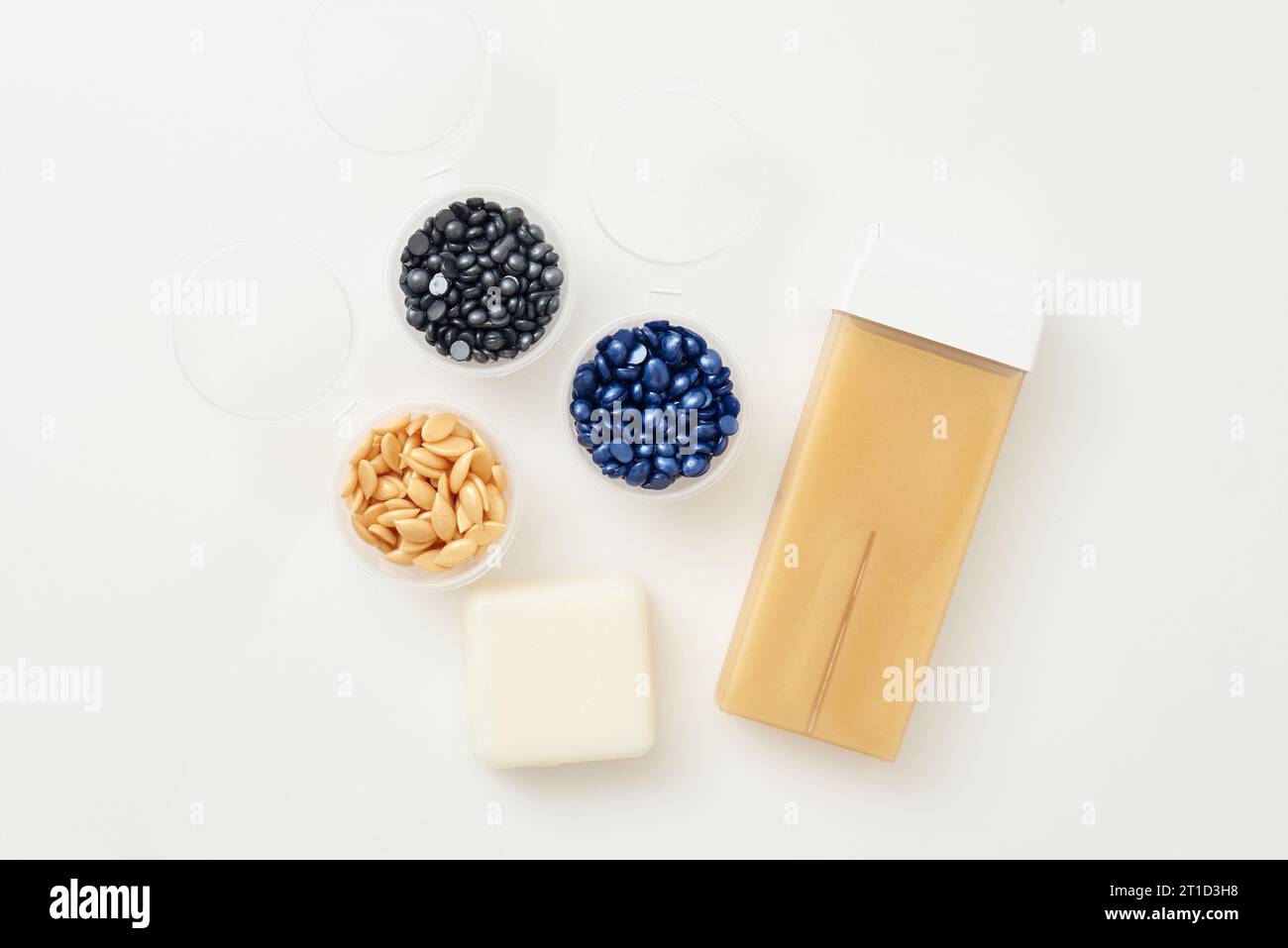 Different types of wax for depilation top view on a white background ...