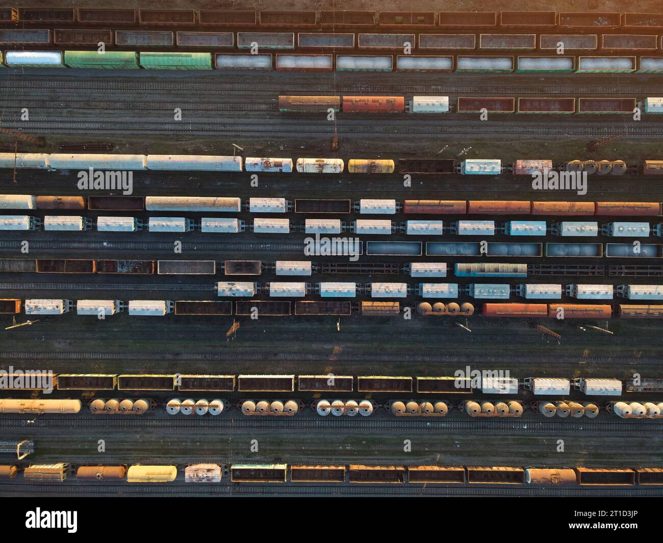 Aerial top view of railway wagons. Cargo trains at sunset Stock Photo ...