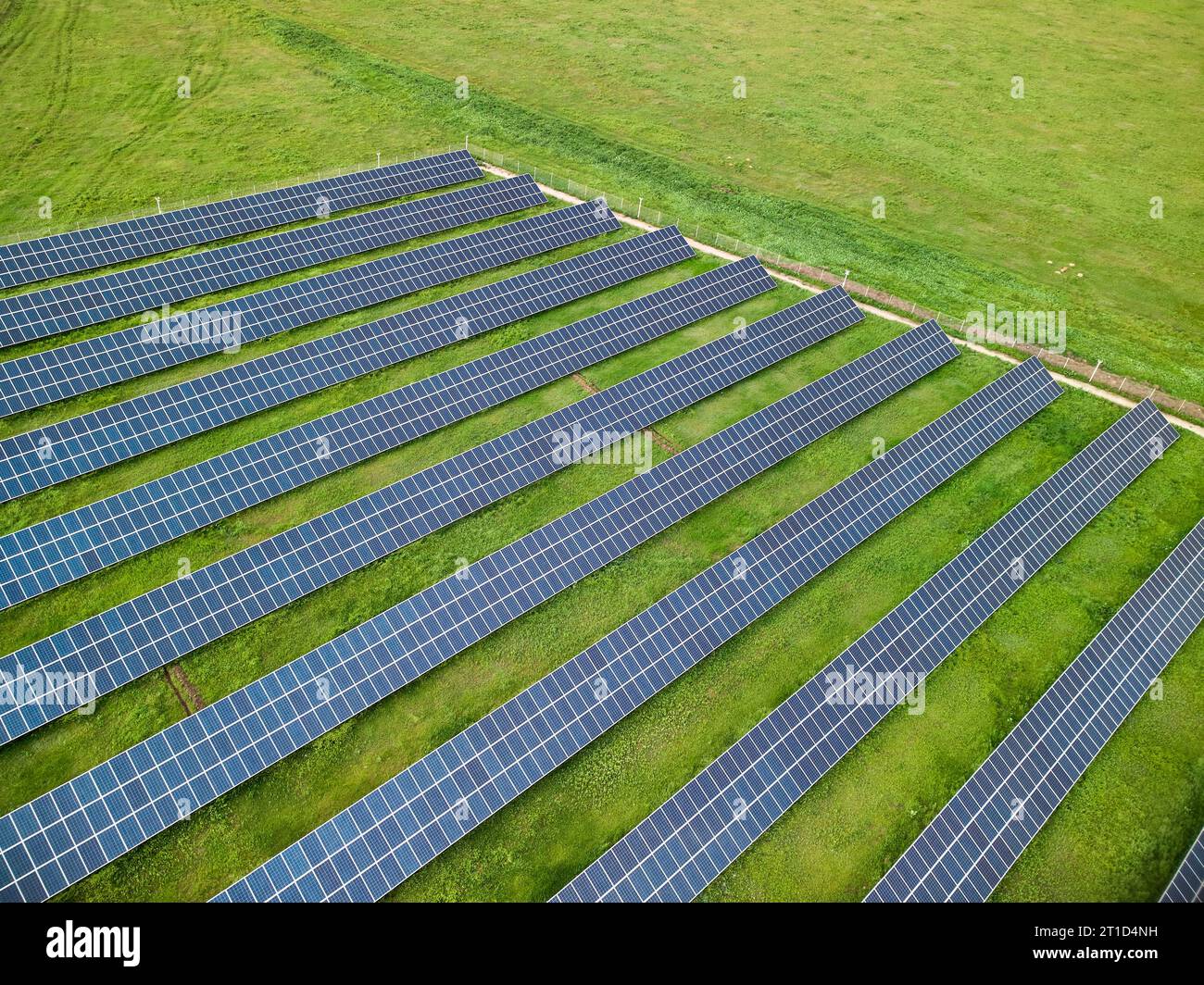 Aerial view of solar power plant in green meadow at sunny day Stock ...