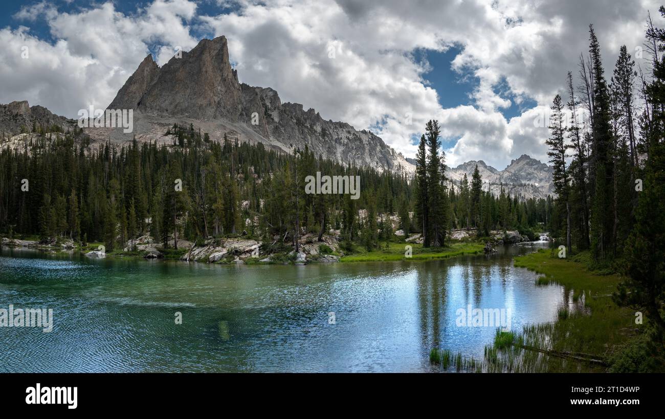 This picture displays a stunning view of a mountain range towering over ...