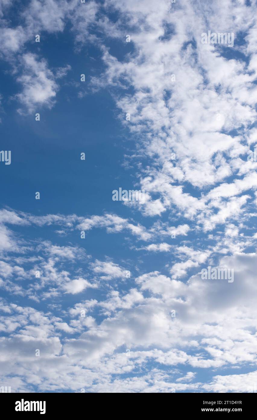 Small fluffy clouds on the blue sky Stock Photo - Alamy