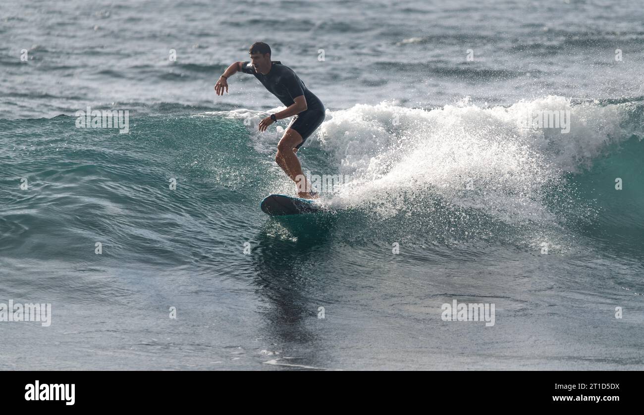 Surfer riding a barrel wave hi-res stock photography and images - Alamy