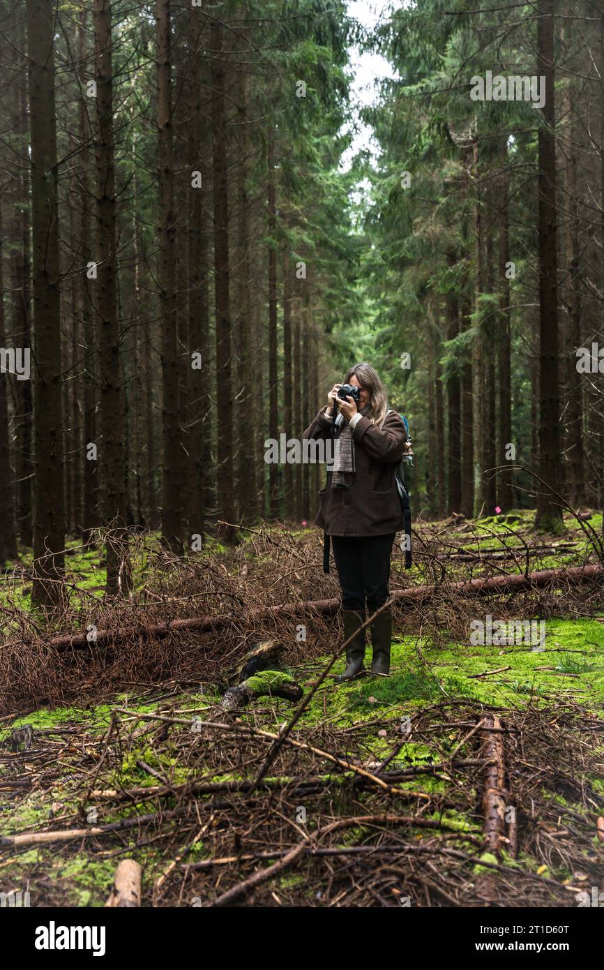 Woman Shooting Photos With Vintage Camera In The Forest in Denmark ...