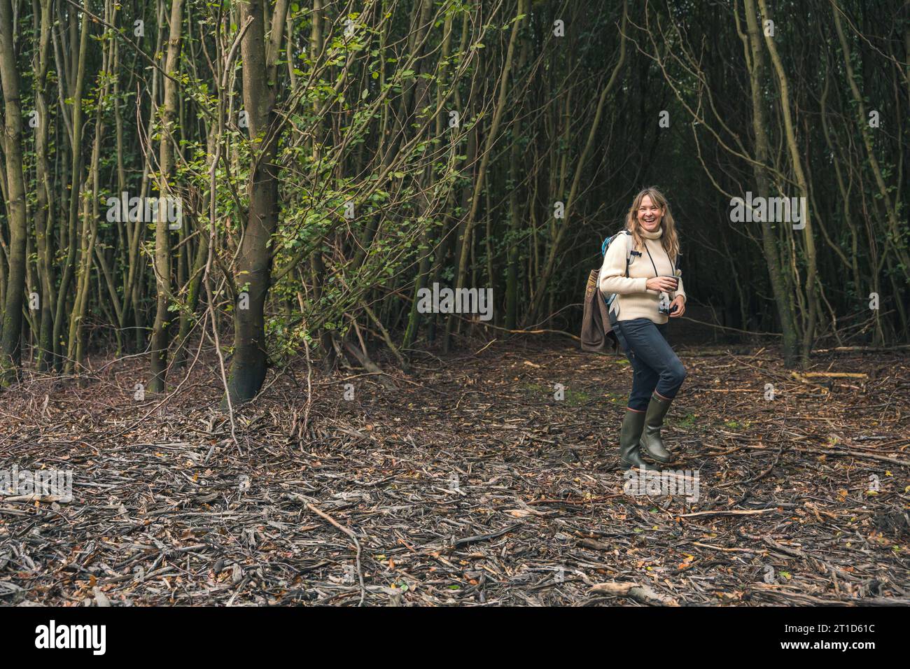 Forager Walking In Forest Clearing With Coffee And Camera In Denmark ...