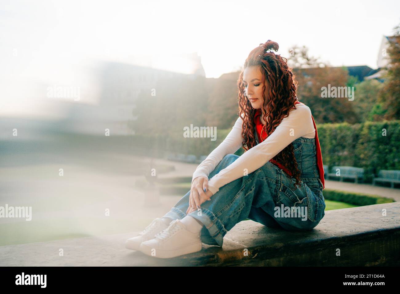Hipster sitting on railing hi-res stock photography and images - Alamy