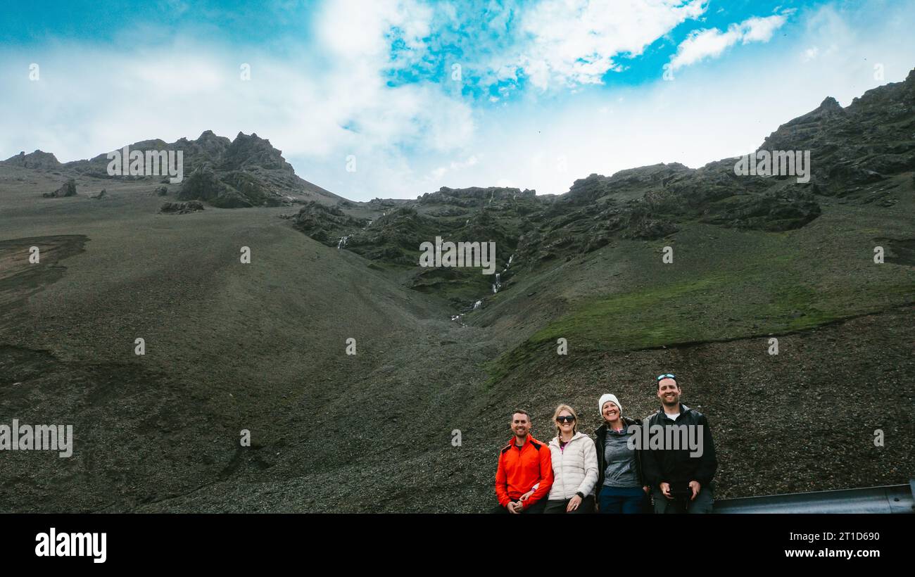 People with big cliff and blue skies on adventure in winter Stock Photo ...