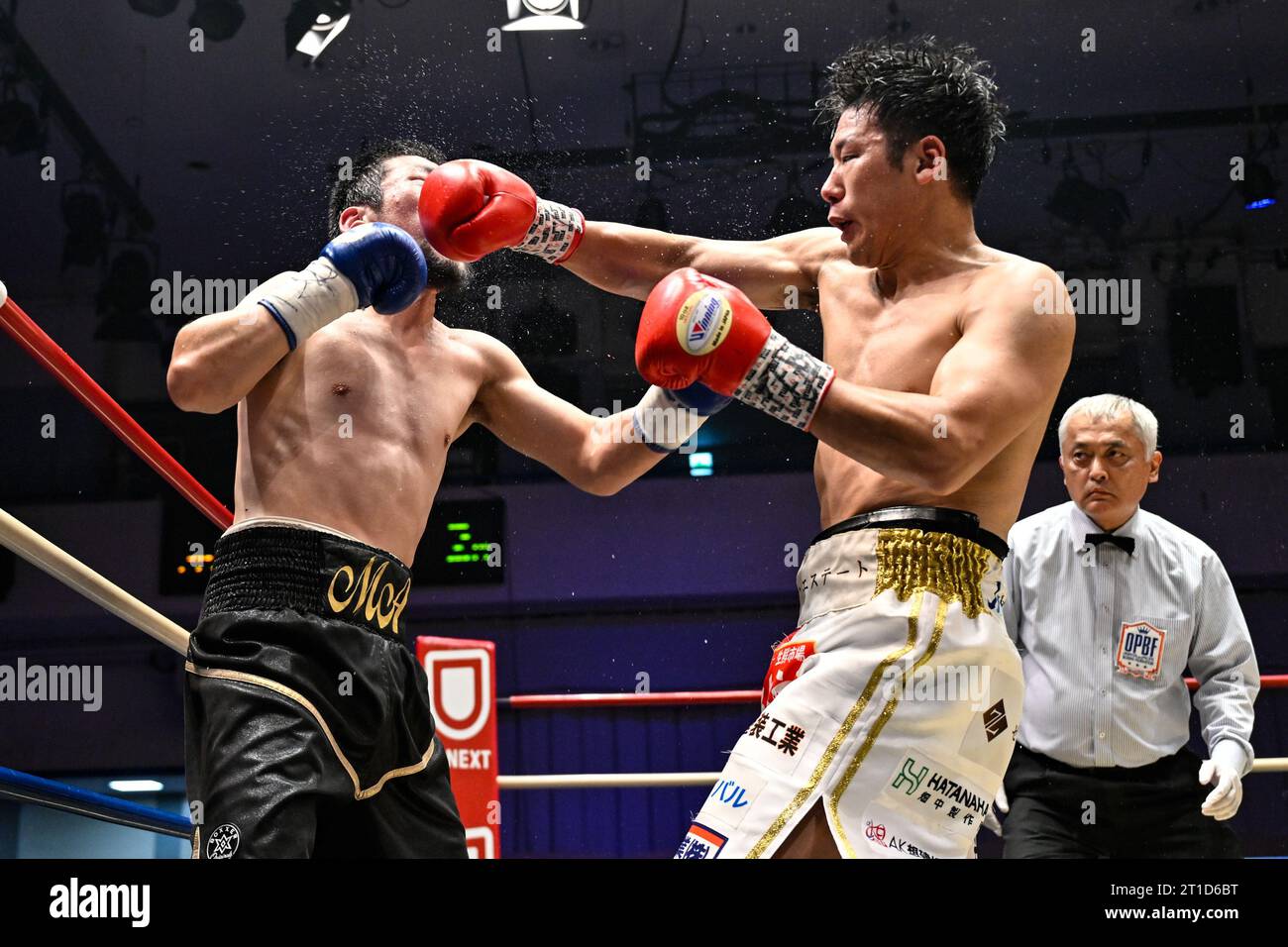 Japan's Kazuto Takesako (red gloves) hits South Korea's Ma Woo-Hyun ...