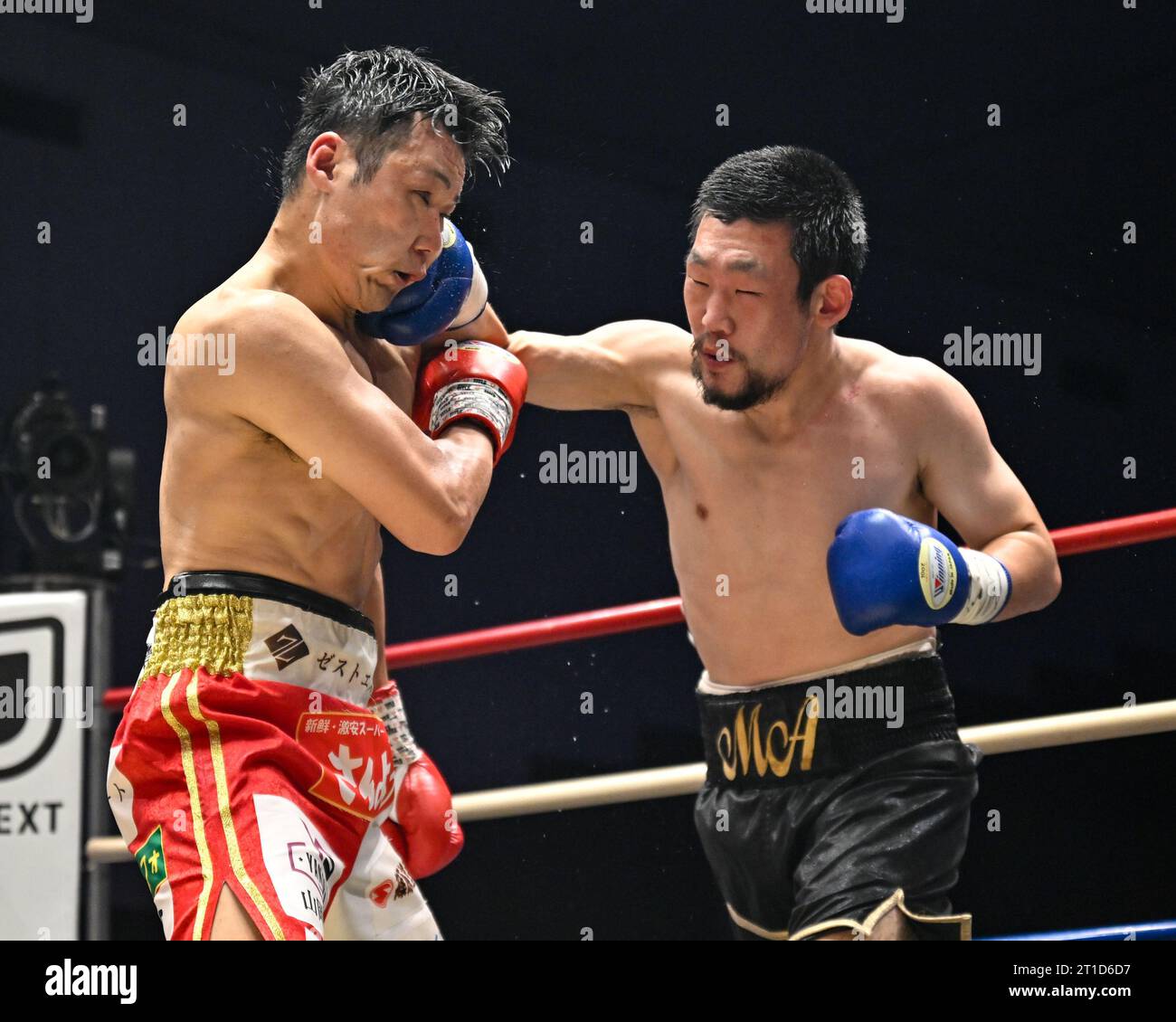 South Korea's Ma Woo-Hyun (blue gloves) hits Japan's Kazuto Takesako ...