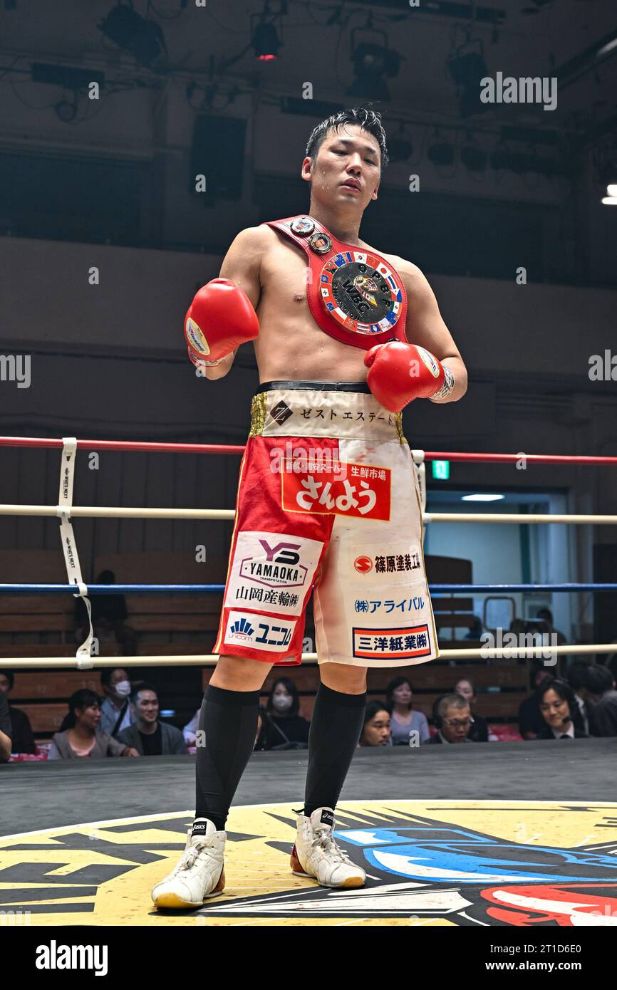 Japan's Kazuto Takesako poses with his championship belt after winning ...