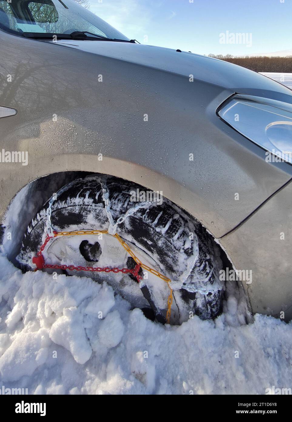 snow chain on a wheel in deep snow in winter road Stock Photo - Alamy