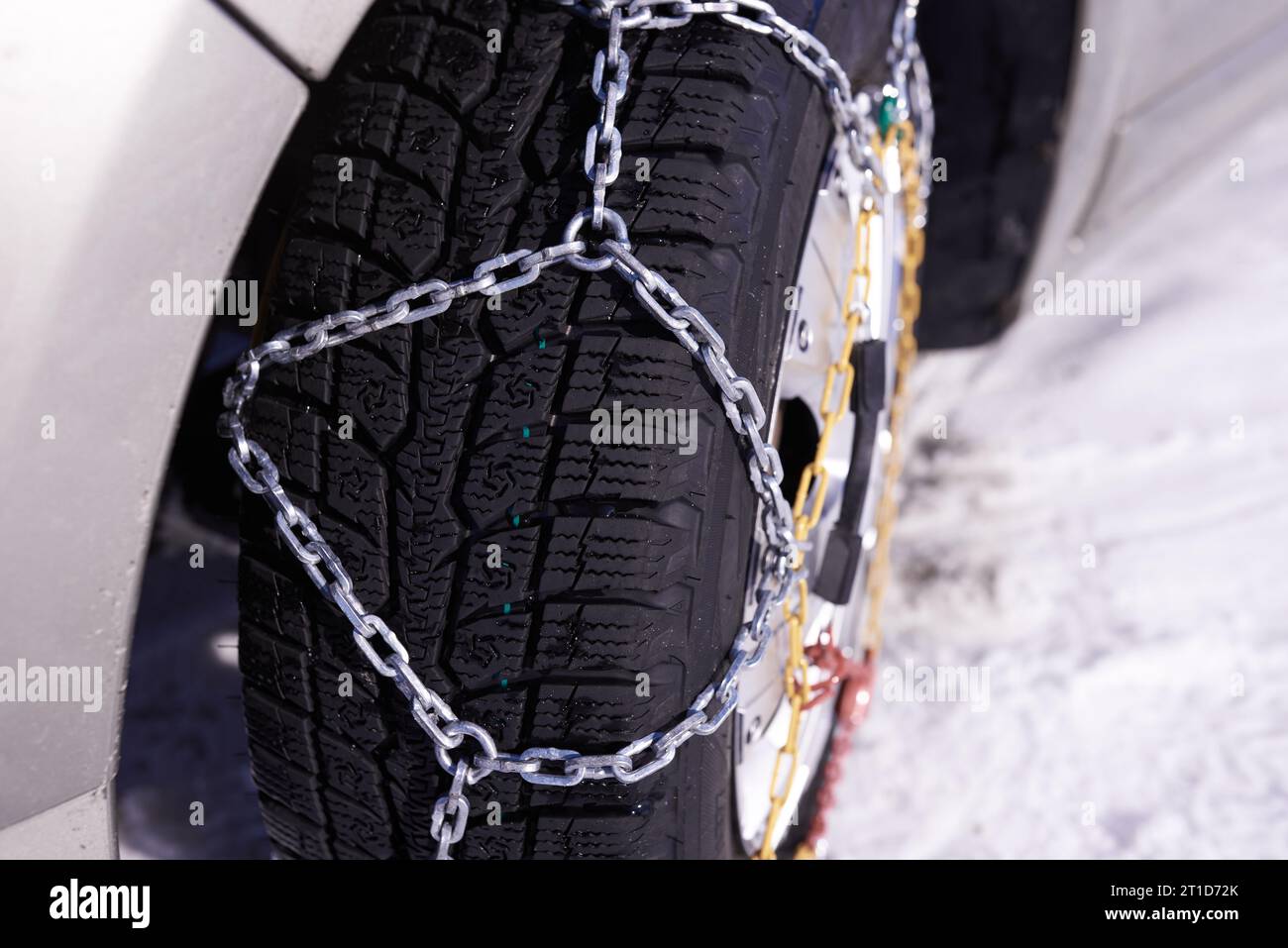 snow chain on a wheel in deep snow in winter road Stock Photo - Alamy