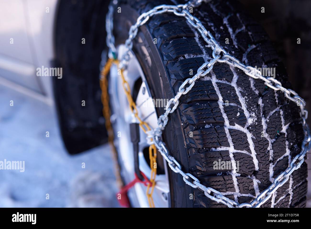 snow chain on a wheel in deep snow in winter road Stock Photo - Alamy