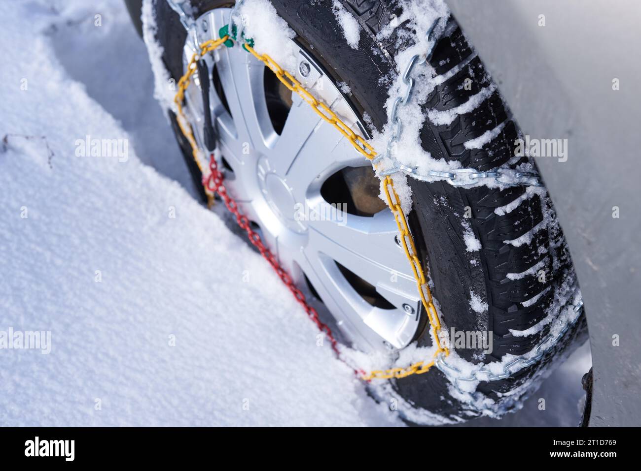 snow chain on a wheel in deep snow in winter road Stock Photo - Alamy