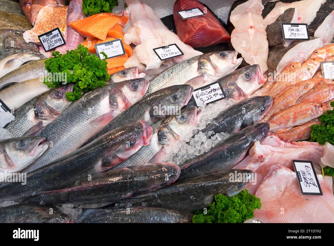 Fresh fish display on ice at counter at Moxon's Fishmongers shop in ...