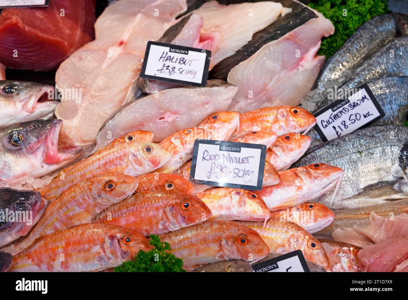 Fresh fish display on ice at counter at Moxon's Fishmongers shop in ...
