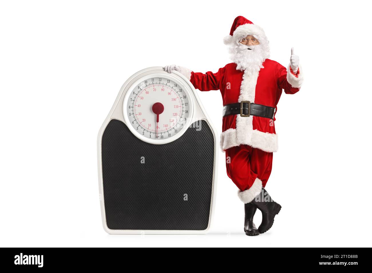 Santa Claus pointing with big weight scale gesturing thumbs up isolated ...