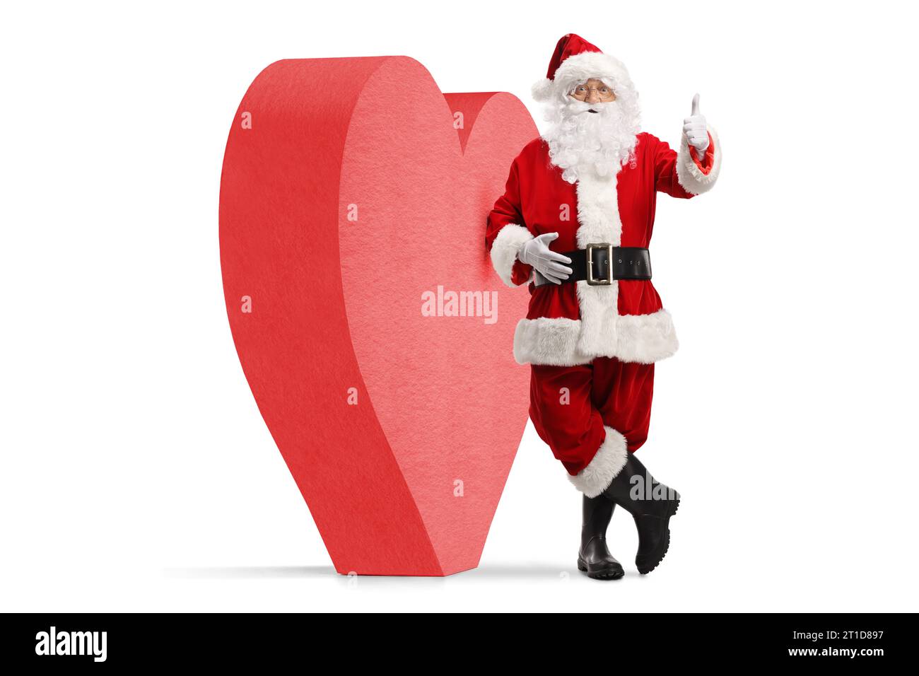 Full length portrait of santa claus leaning on a red heart and ...