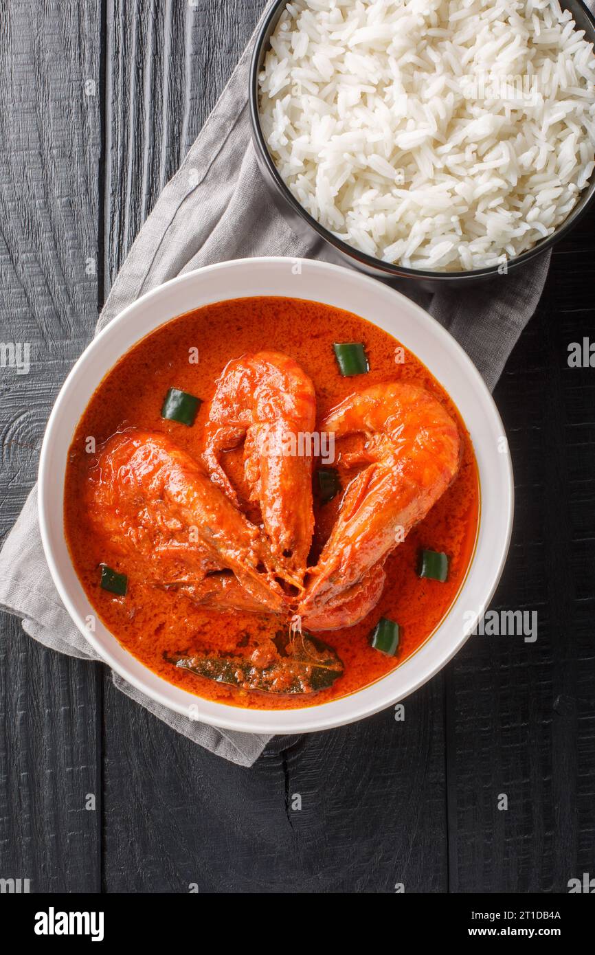 Chingri Macher Malai Curry is a traditional Bengali cooked with sauteed ...