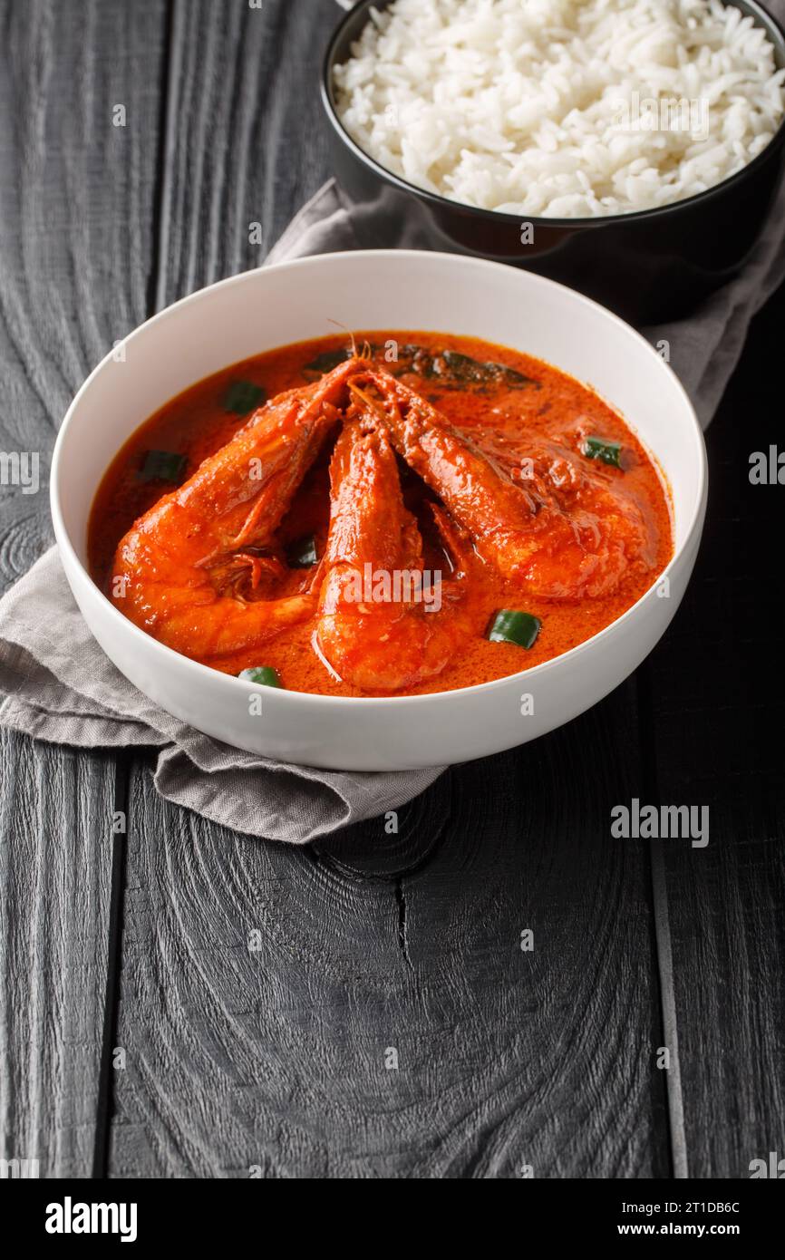 Whole Tiger Prawn Malai Curry served with white rice closeup on the ...