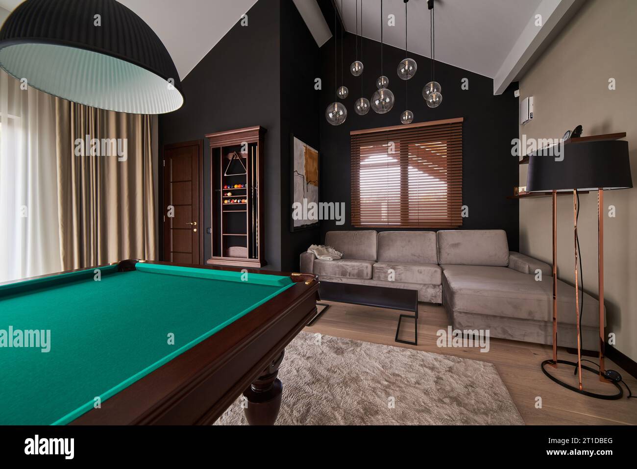 modern billiard room with a beautiful table and large windows, nobody ...