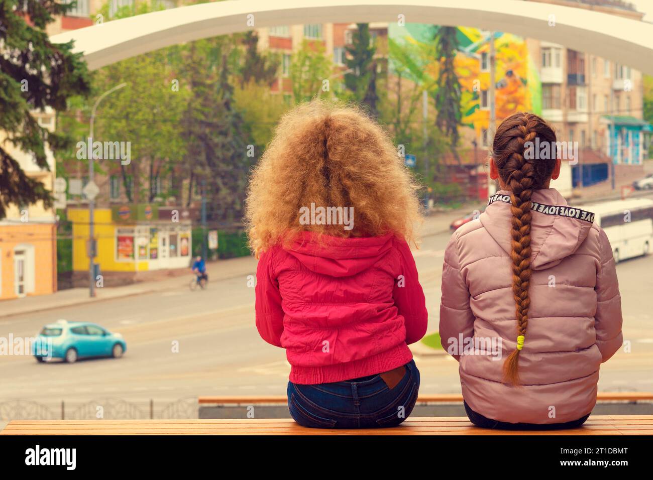 happy girls on the background of the city. happy friends meeting up ...