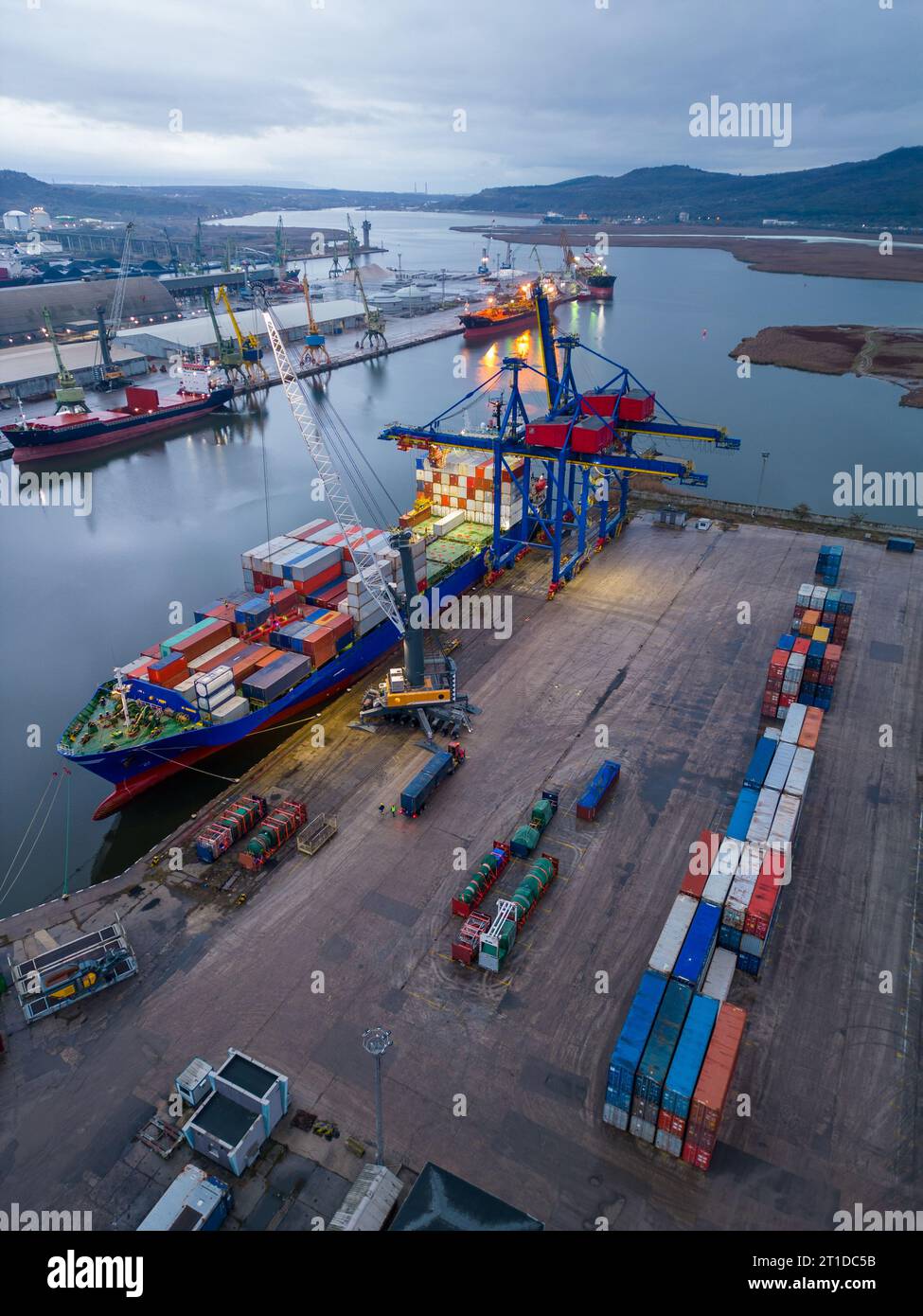 Aerial drone view of Large car cargo ferry boat ship entering the port ...