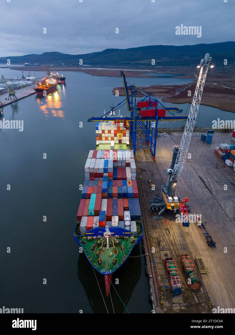 Aerial drone view of Large car cargo ferry boat ship entering the port ...