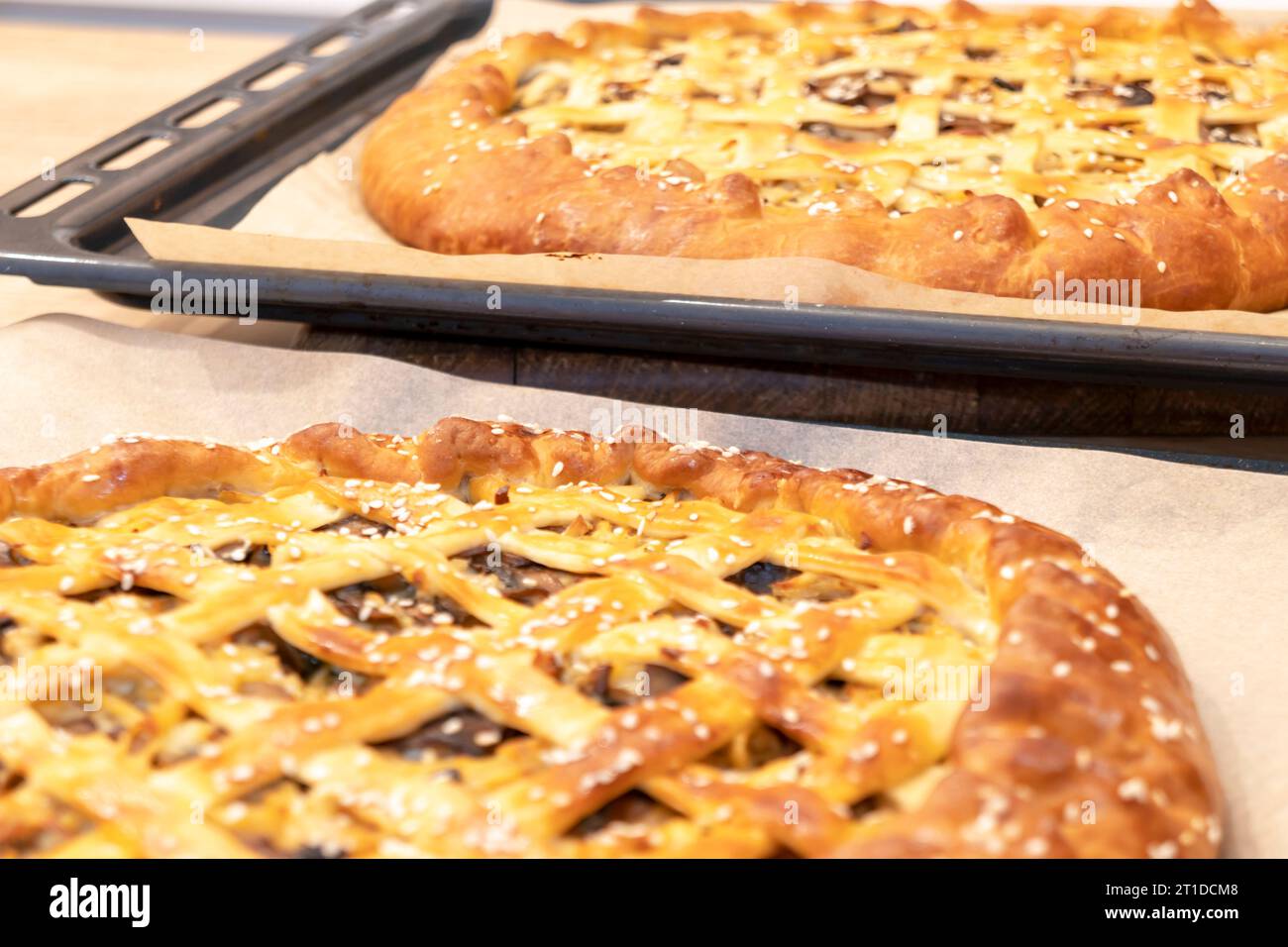 Pies on a baking sheet. homemade pie, Home baking concept Stock Photo ...