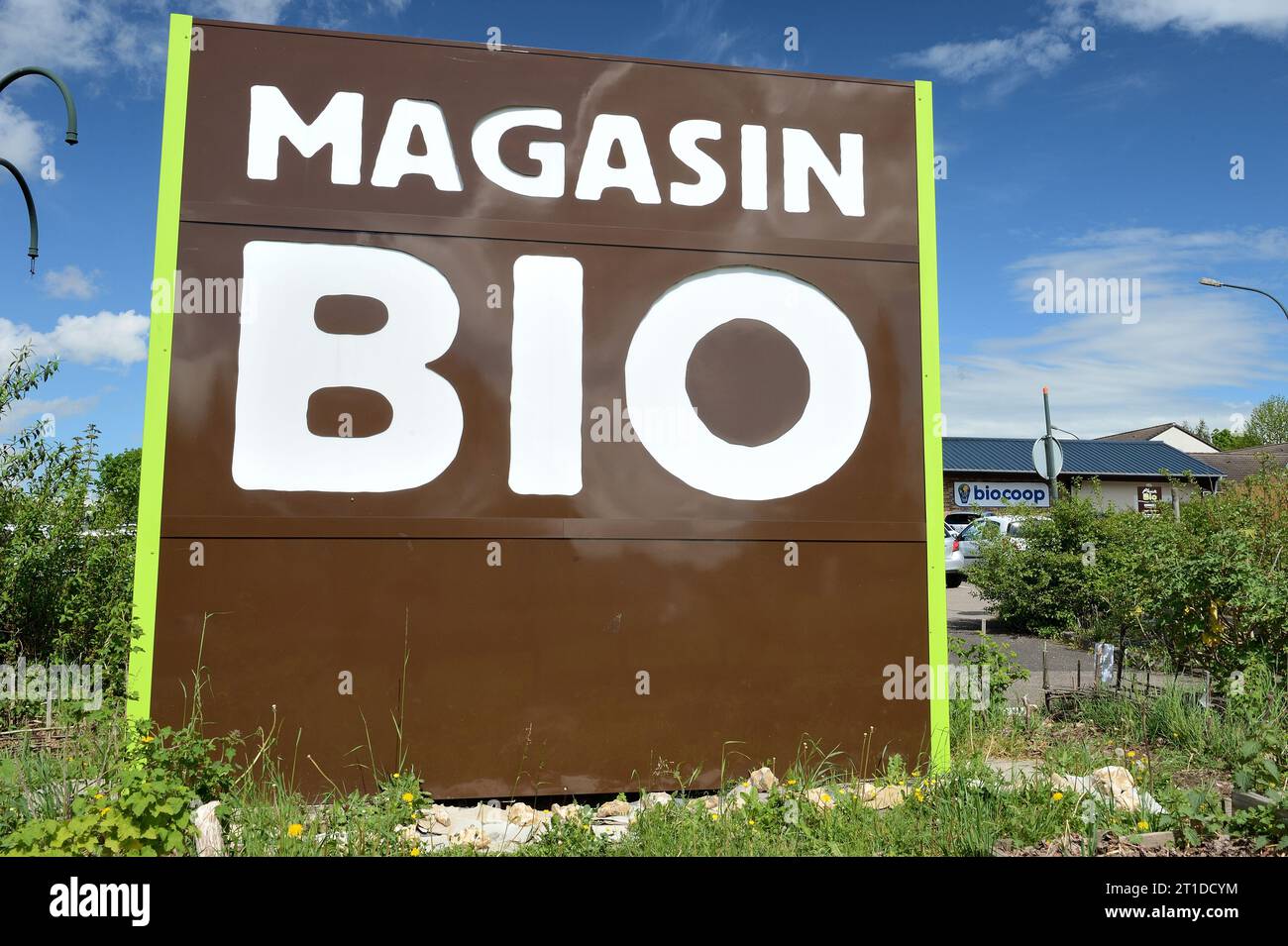 Organic shop sign and Biocoop shop in the background Stock Photo - Alamy