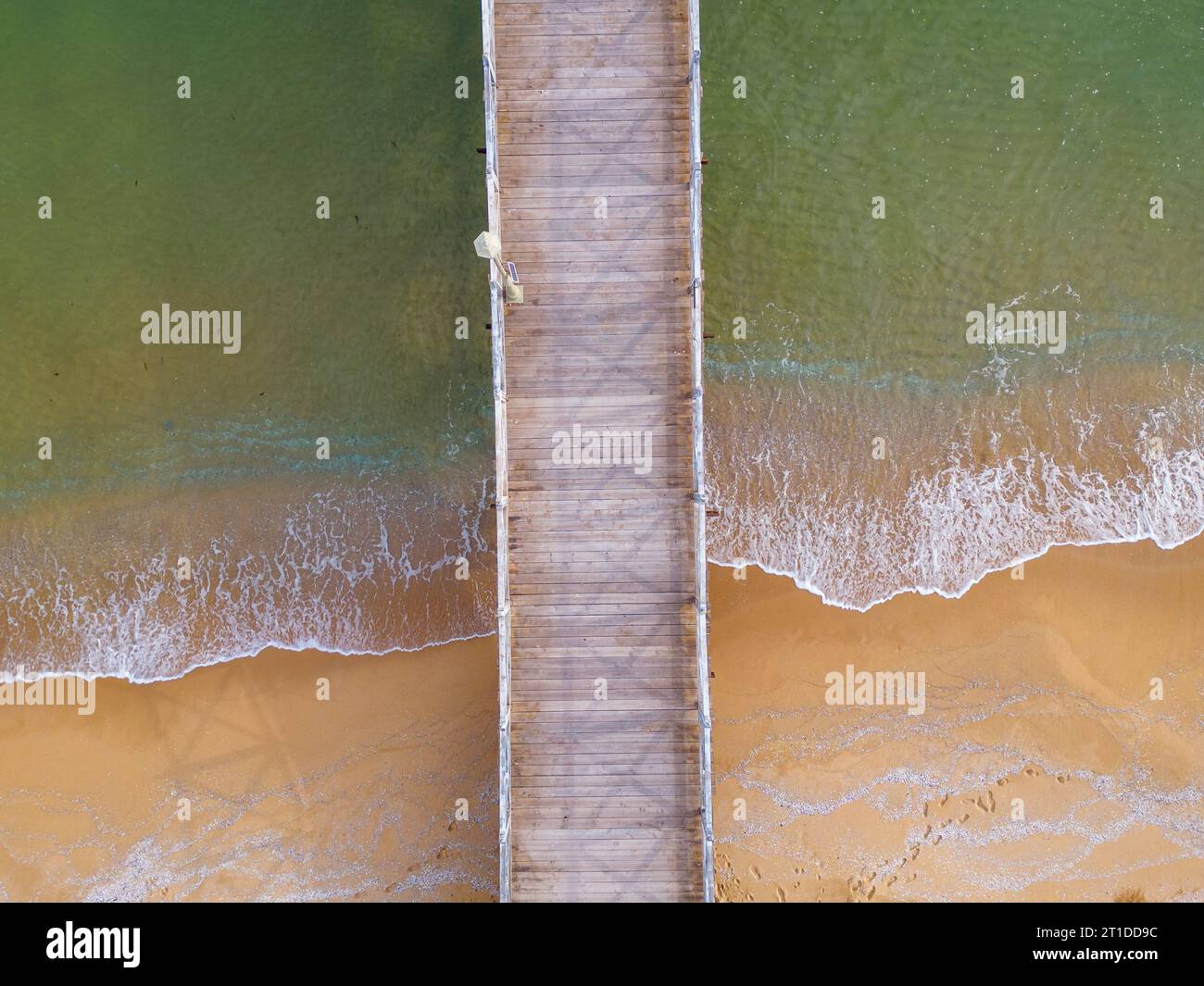 Aerial top down view of a wooden deserted pier in the sea Stock Photo ...