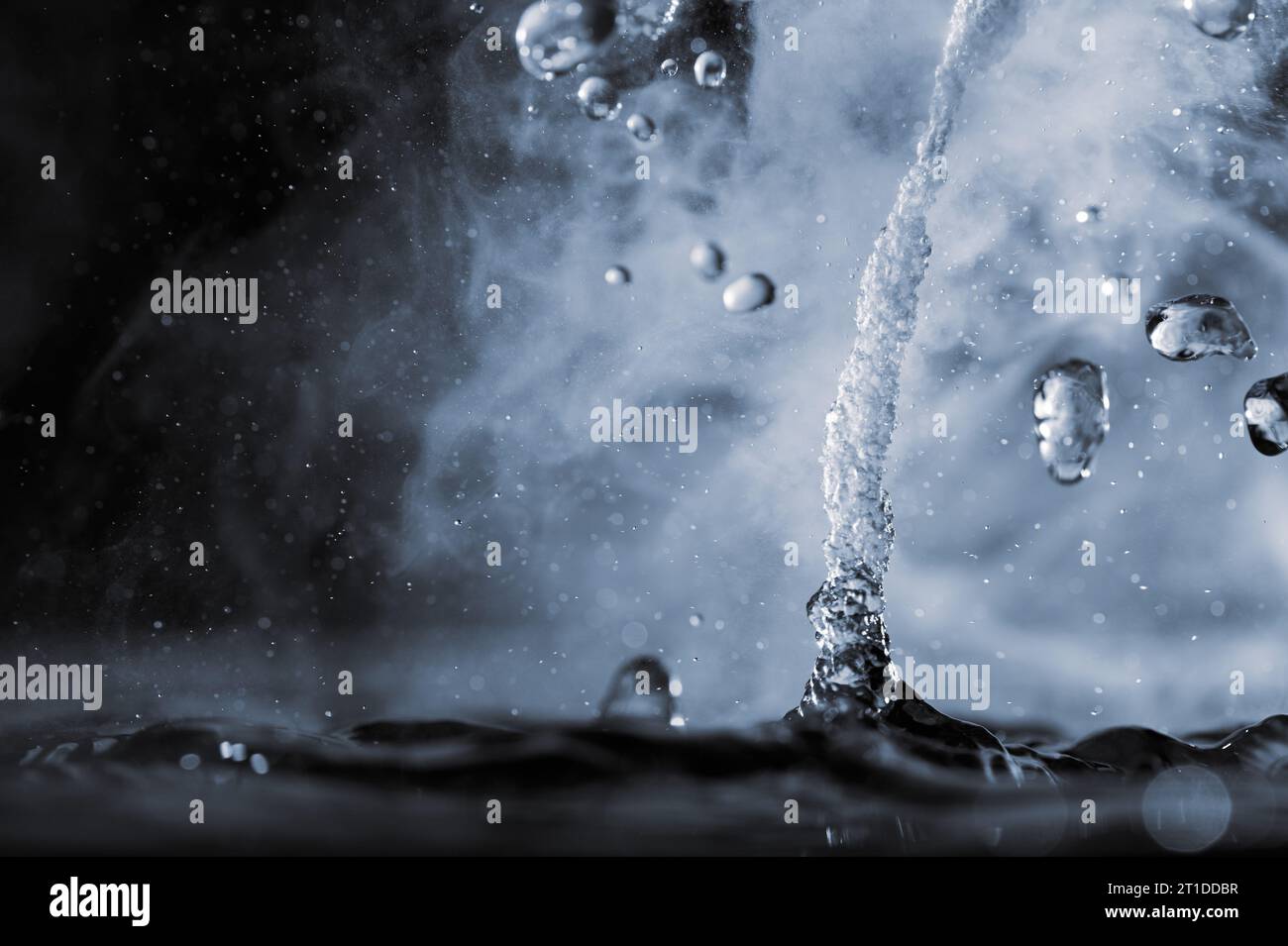 Boiling water splash with steam on black background close-up Stock ...