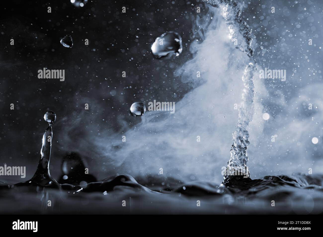 Boiling water splash with steam on black background close-up Stock ...