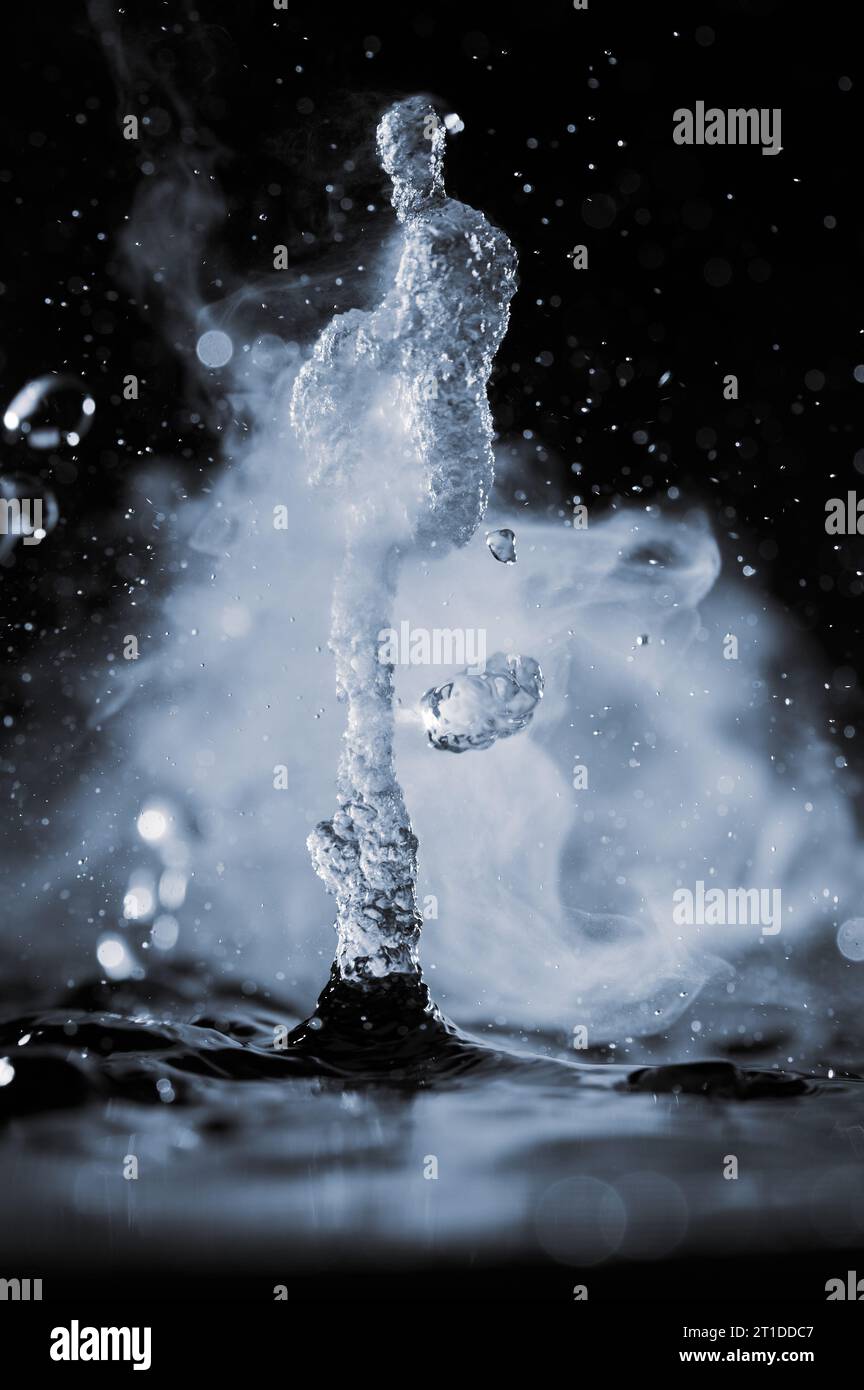 Boiling water splash with steam on black background close-up Stock ...