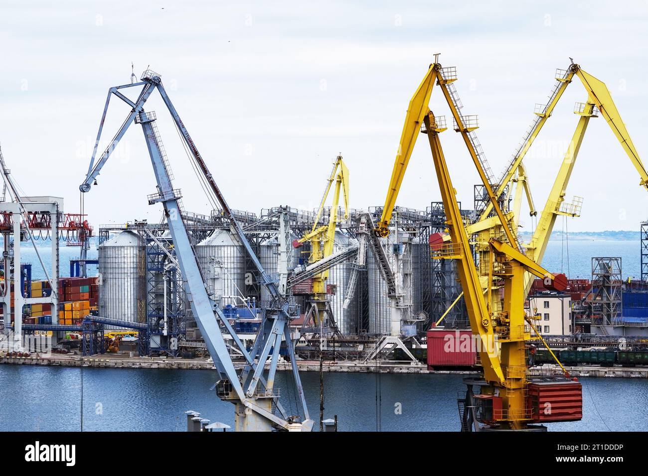 Port Cranes on a Pier of Seaport. Industrial freight.Container terminal ...
