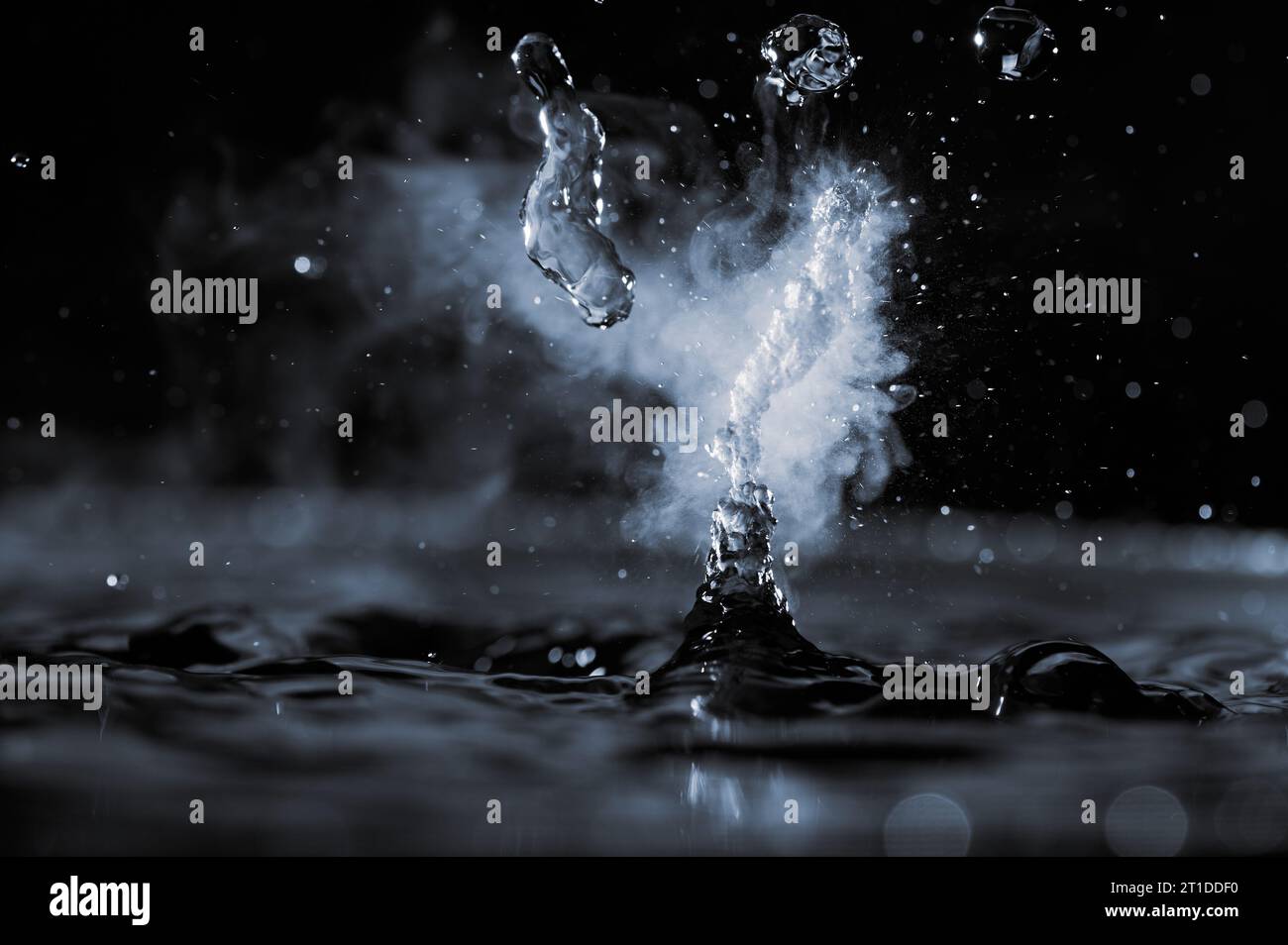 Boiling water splash with steam on black background close-up Stock ...