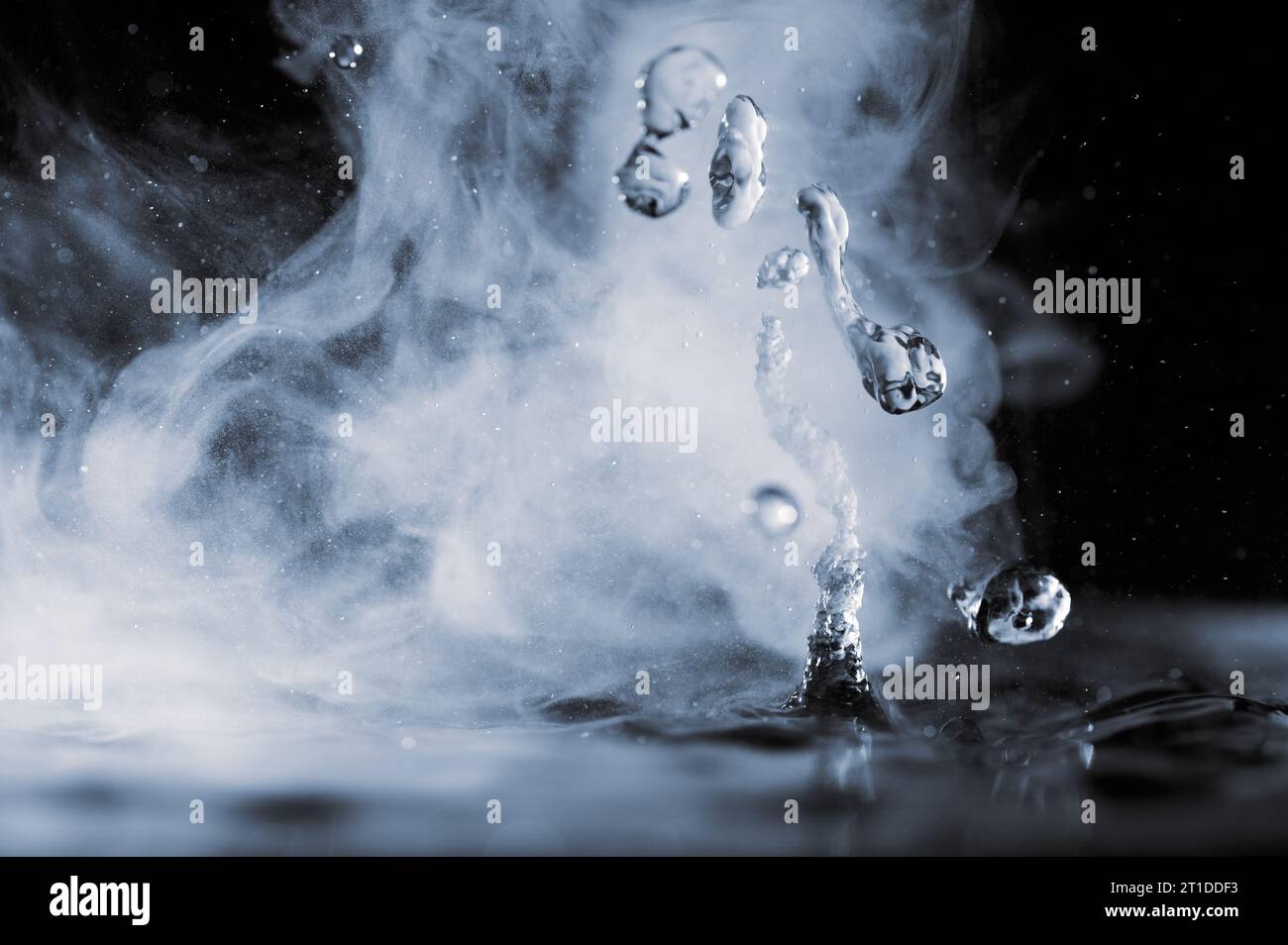 Boiling water splash with steam on black background close-up Stock ...