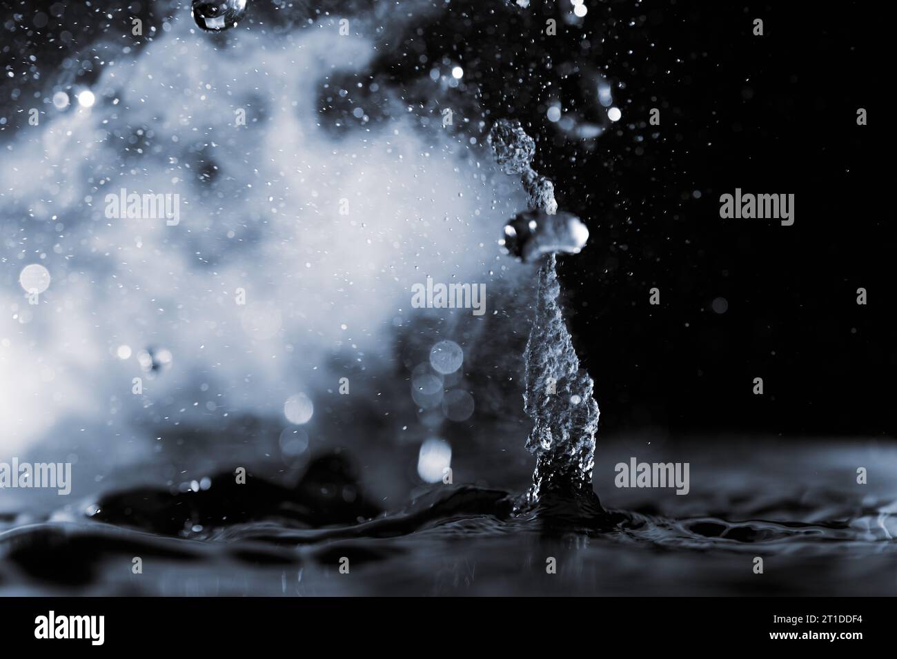 Boiling water splash with steam on black background close-up Stock ...