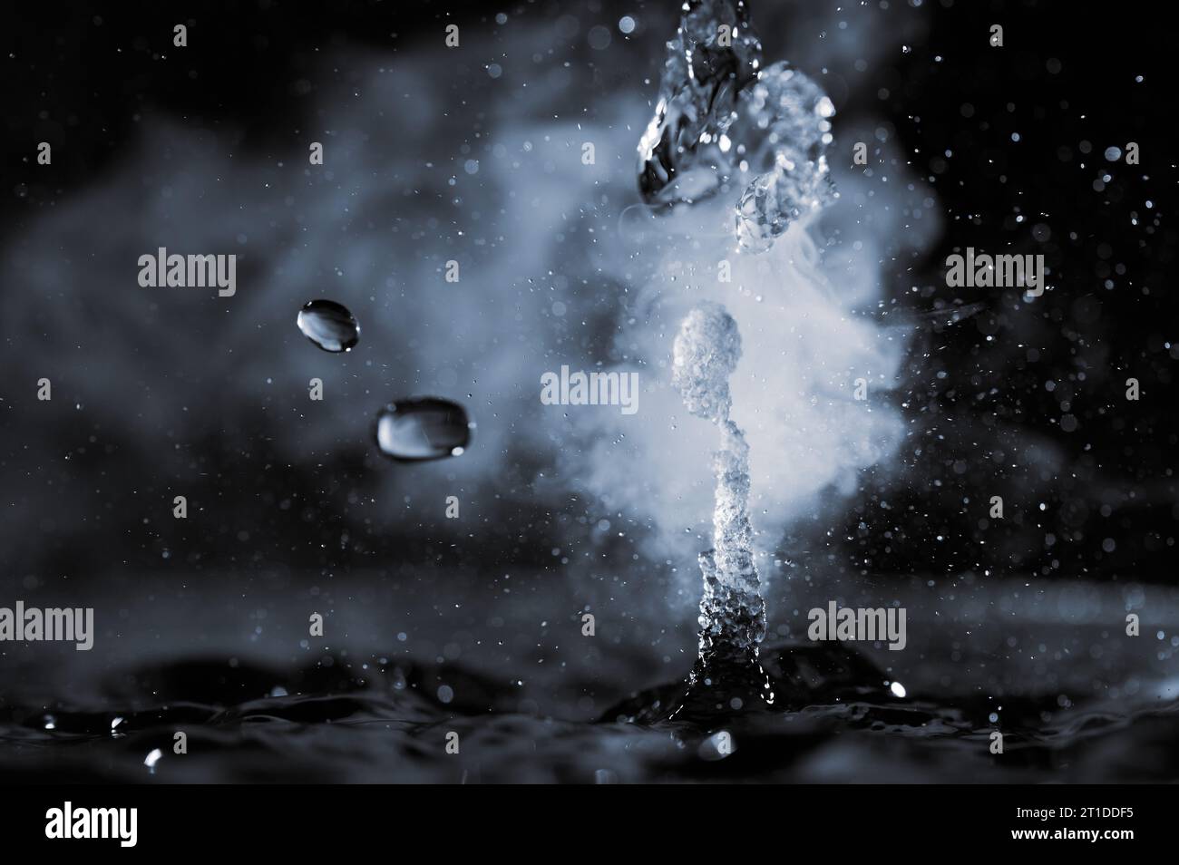 Boiling water splash with steam on black background close-up Stock ...