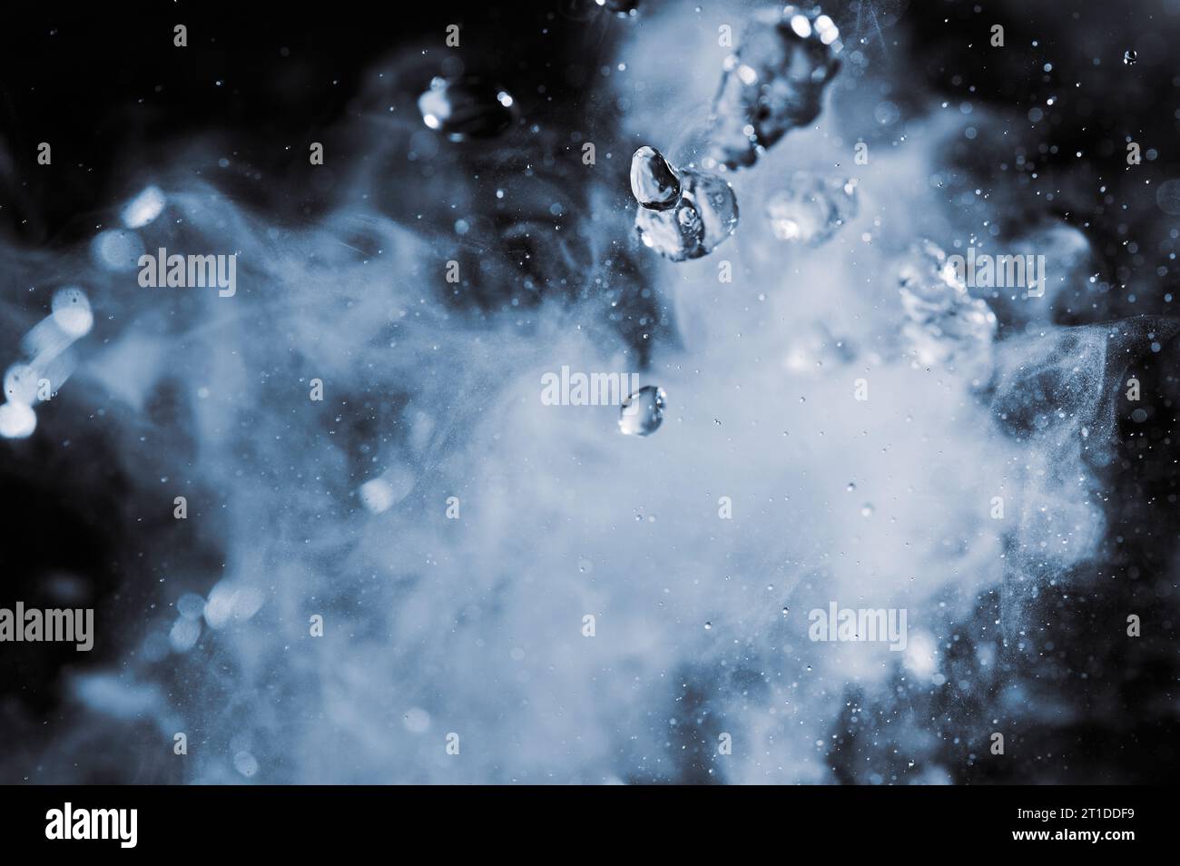 Boiling water splash with steam on black background close-up Stock ...