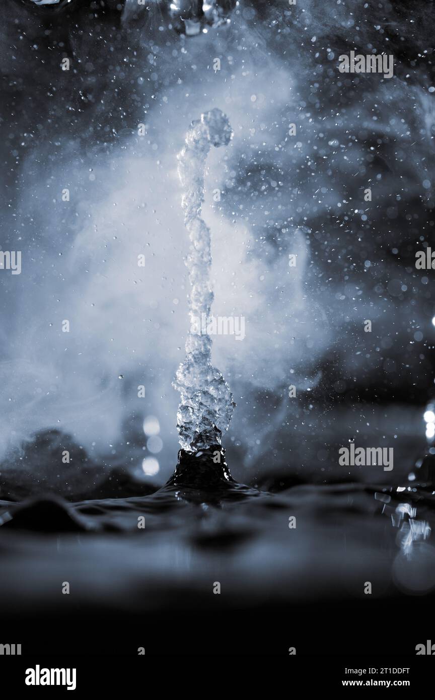 Boiling water splash with steam on black background close-up Stock ...