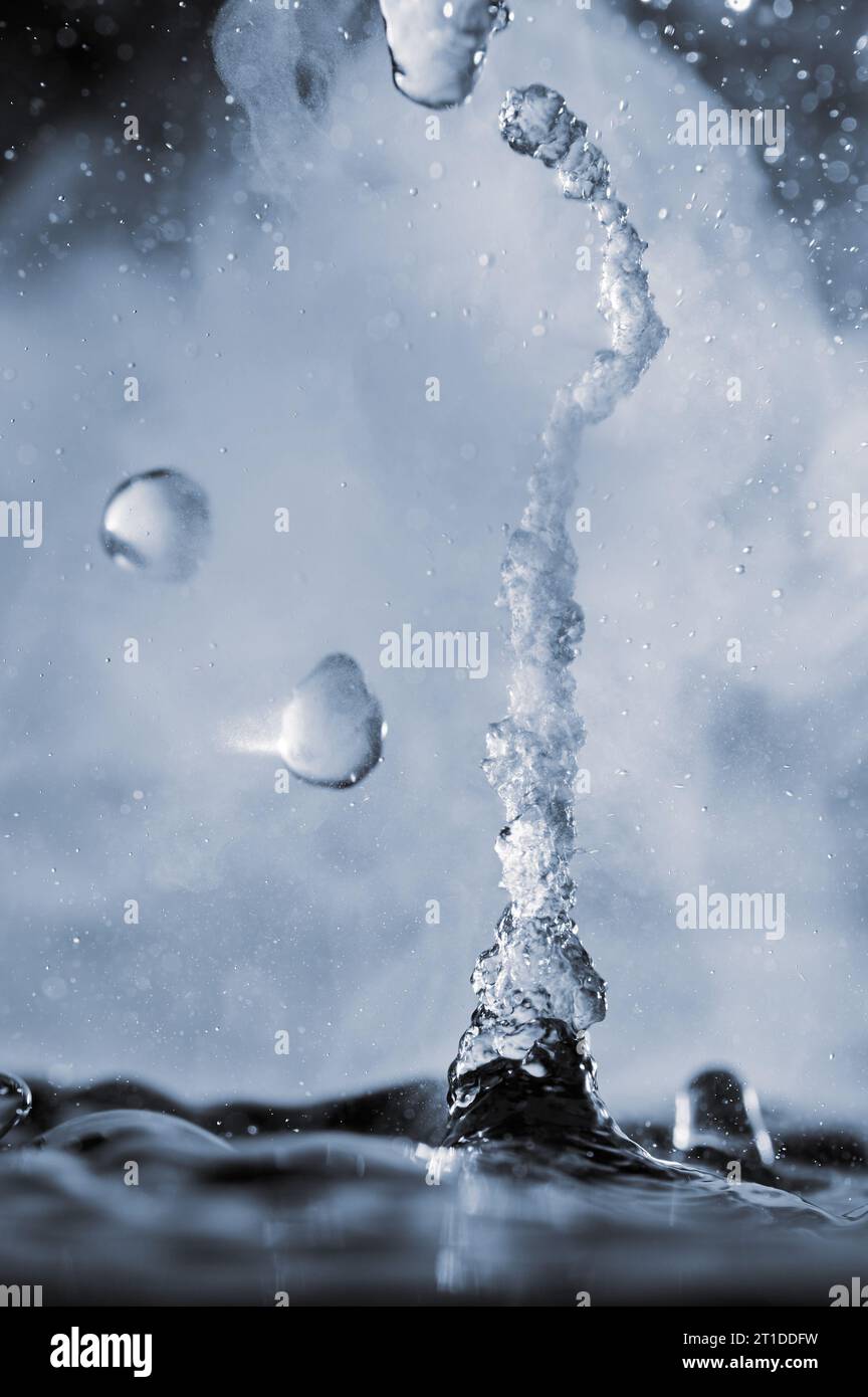 Boiling water splash with steam on black background close-up Stock ...