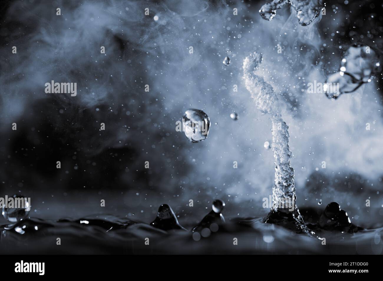 Boiling water splash with steam on black background close-up Stock ...