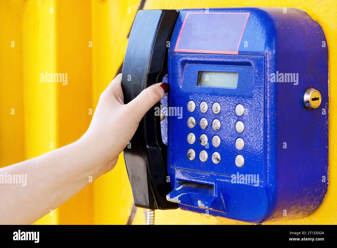 Girl calling from telephone booth hi-res stock photography and images ...