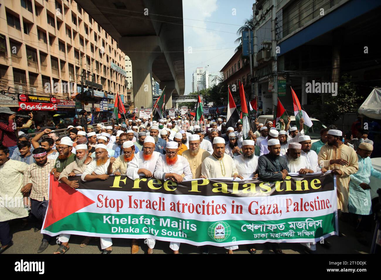 Dhaka, Bangladesh. 13th Oct, 2023. Protestors wave Palestinian flags as ...