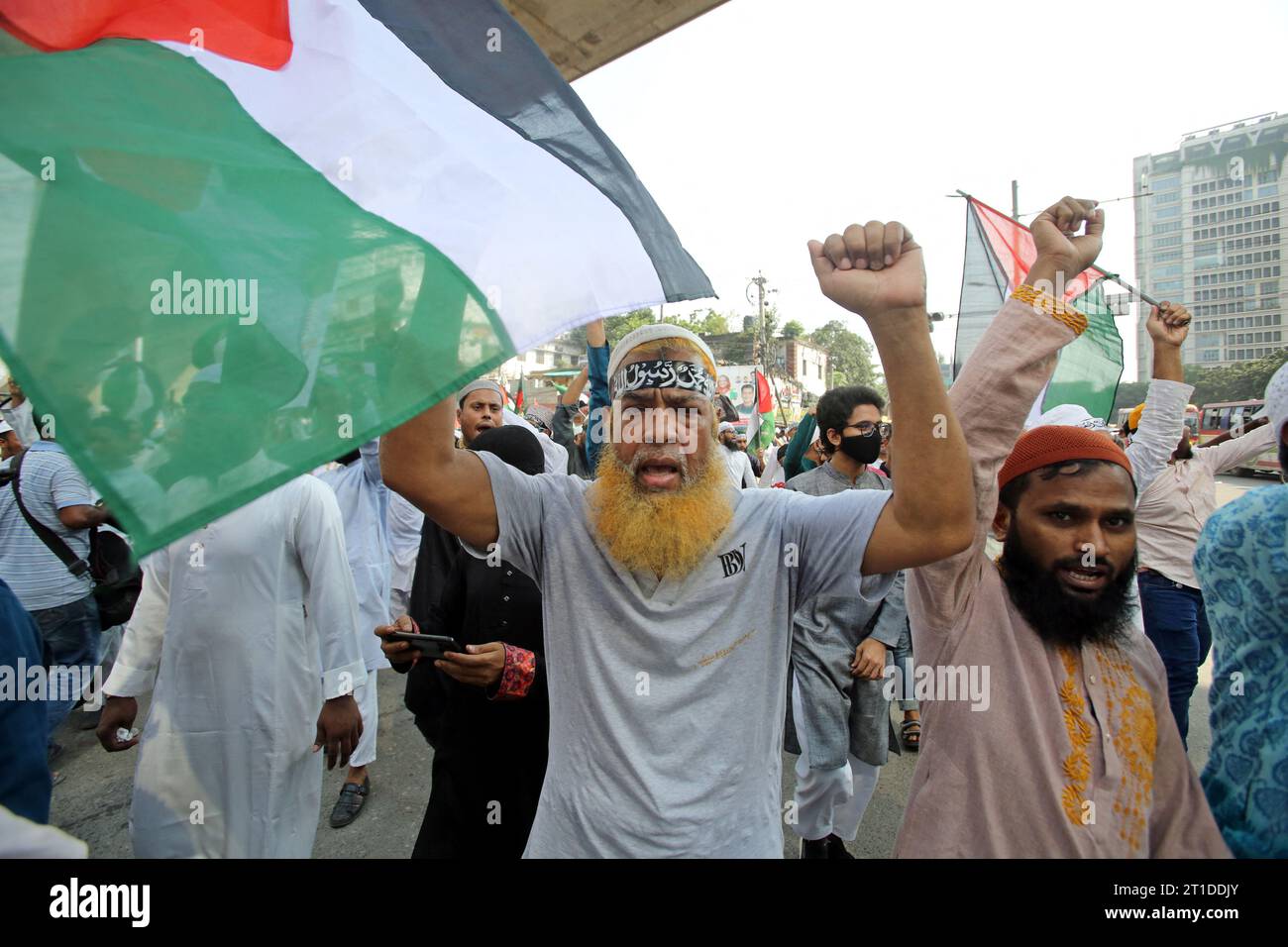 Dhaka, Bangladesh. 13th Oct, 2023. Protestors wave Palestinian flags as ...
