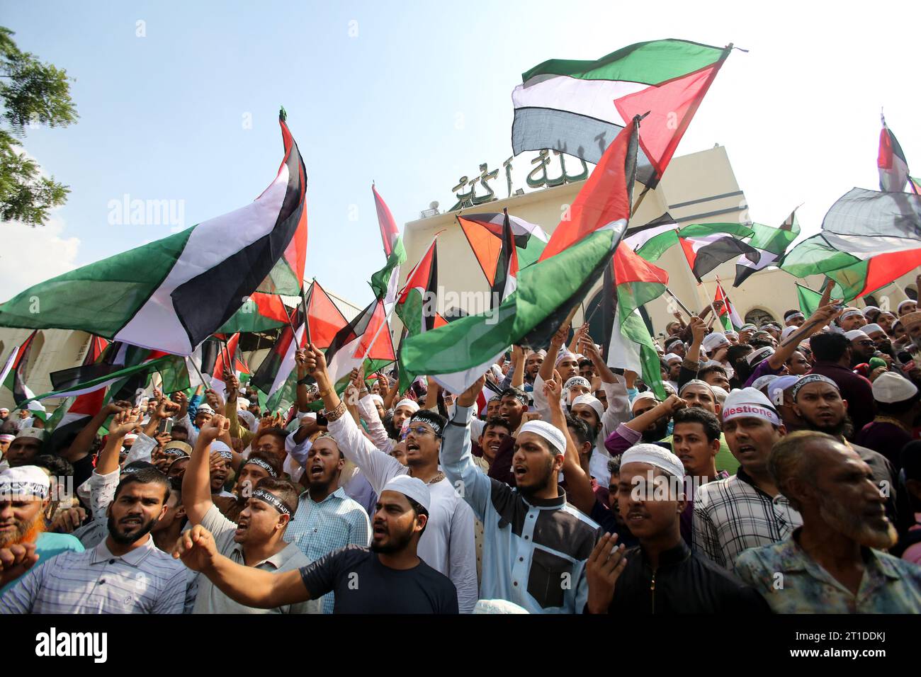 Dhaka, Bangladesh. 13th Oct, 2023. Protestors wave Palestinian flags as ...