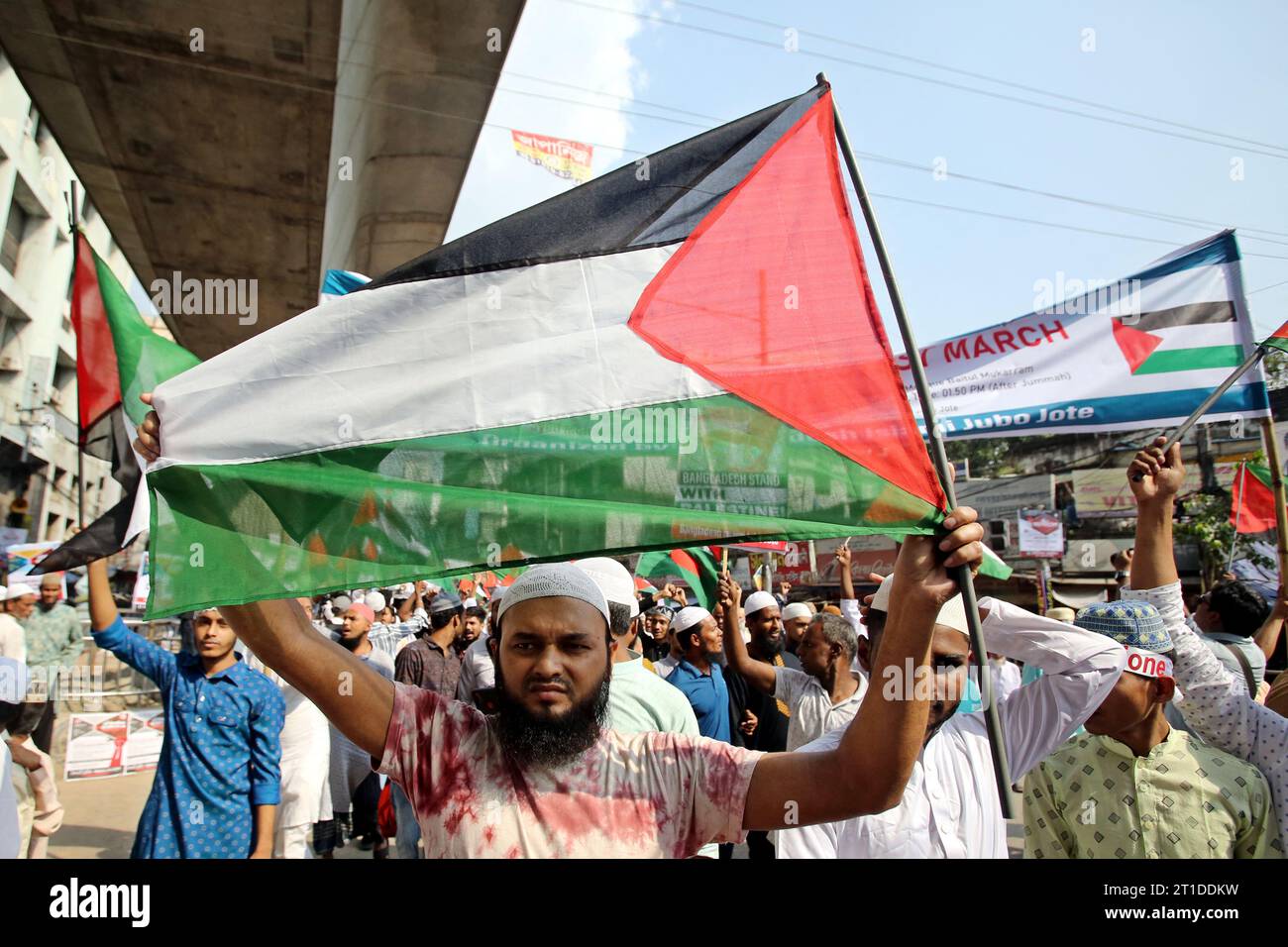 Dhaka, Bangladesh. 13th Oct, 2023. Protestors wave Palestinian flags as ...